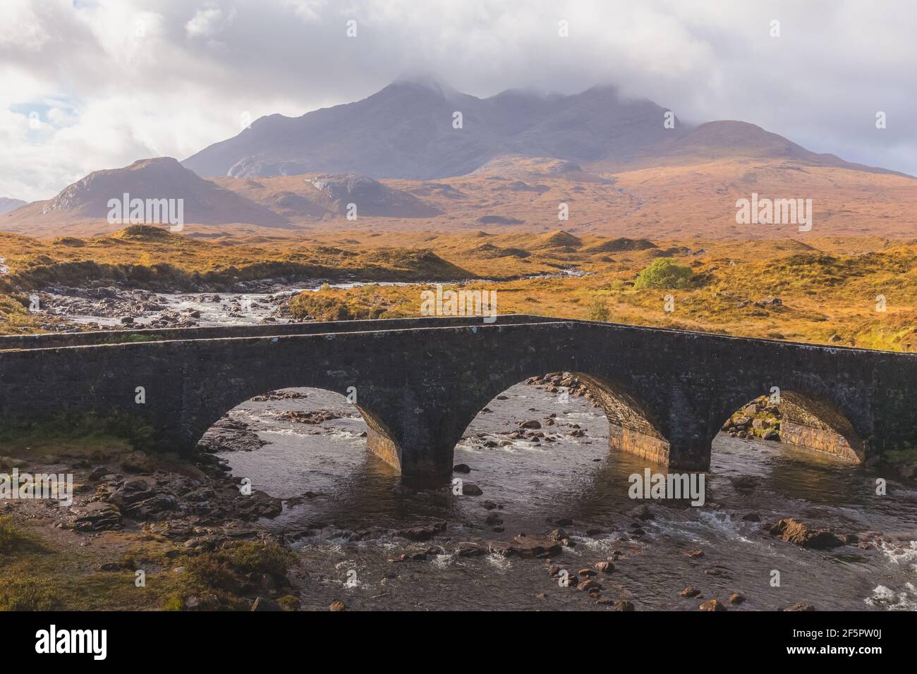 Old stone bridge over River Sligachan with Black Cuillins mountain ...