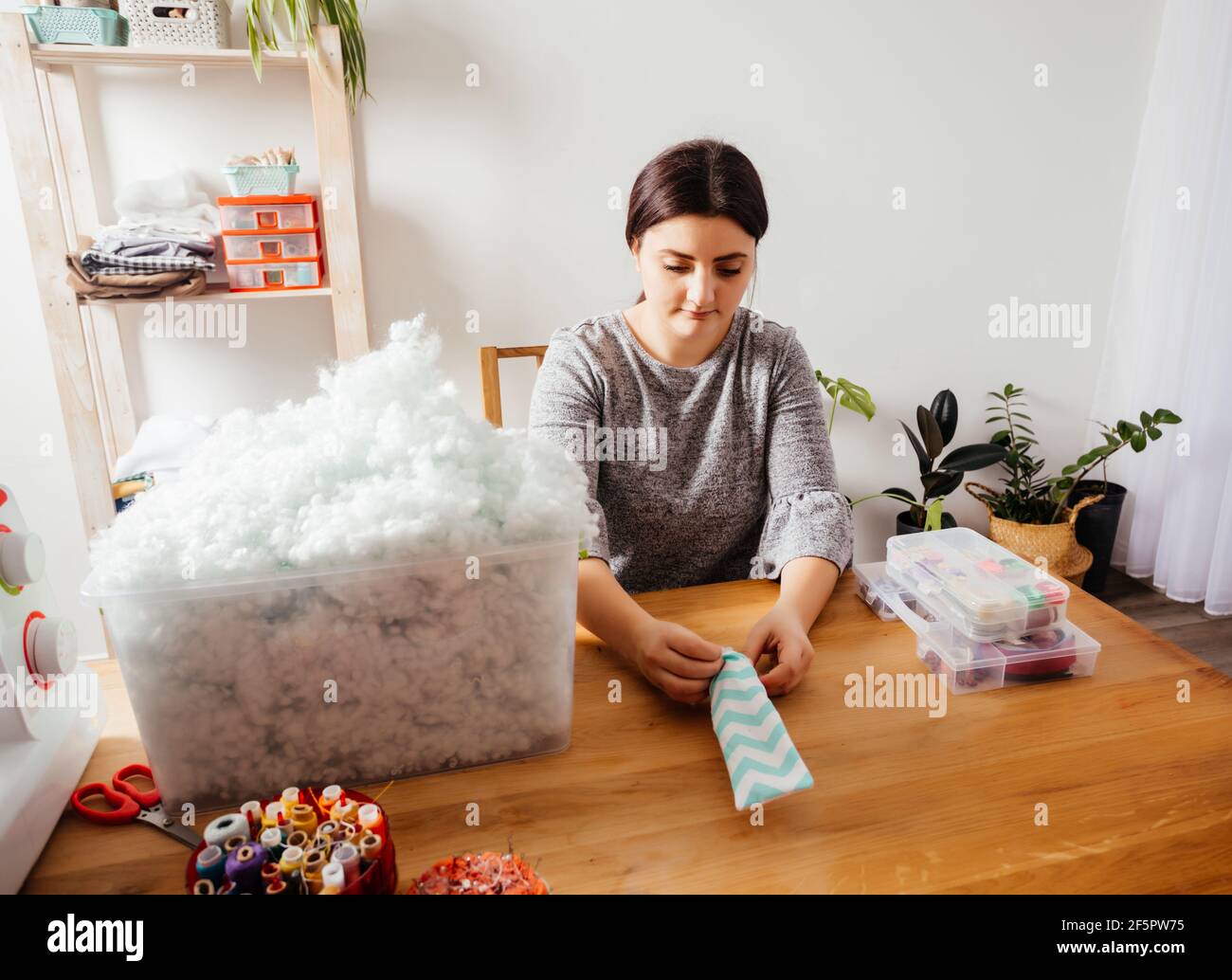 Process of handmade toys stuffing with fluffy hollofiber Stock Photo ...