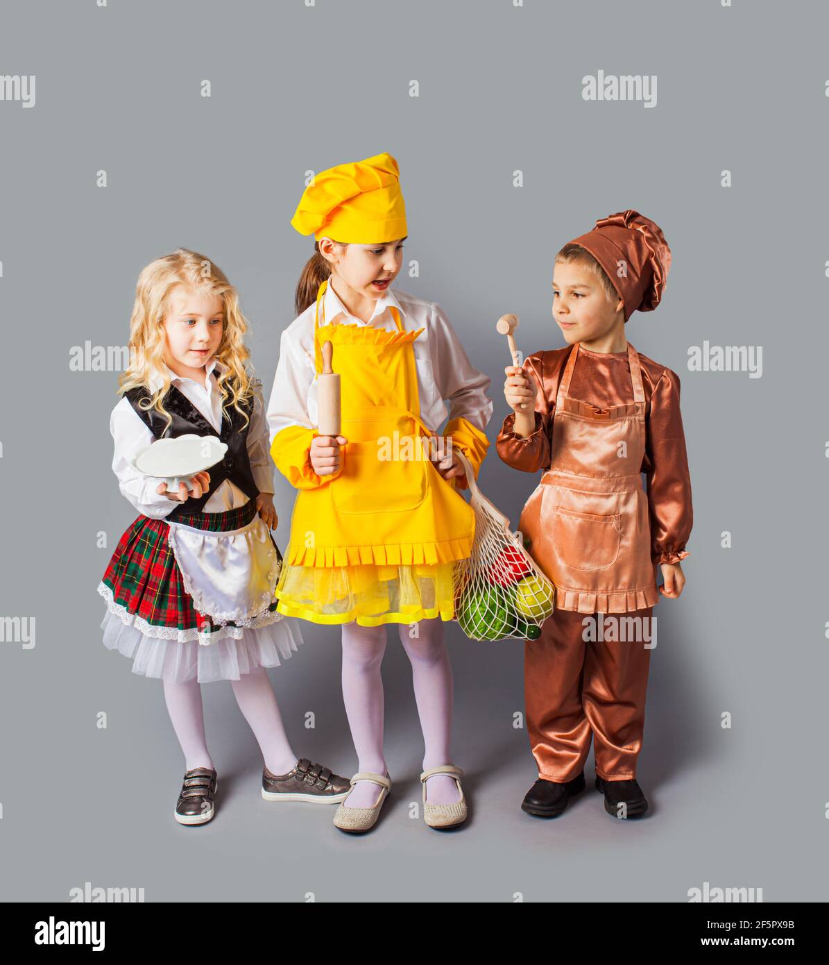 the little kids in costume of chef and waiter Stock Photo - Alamy