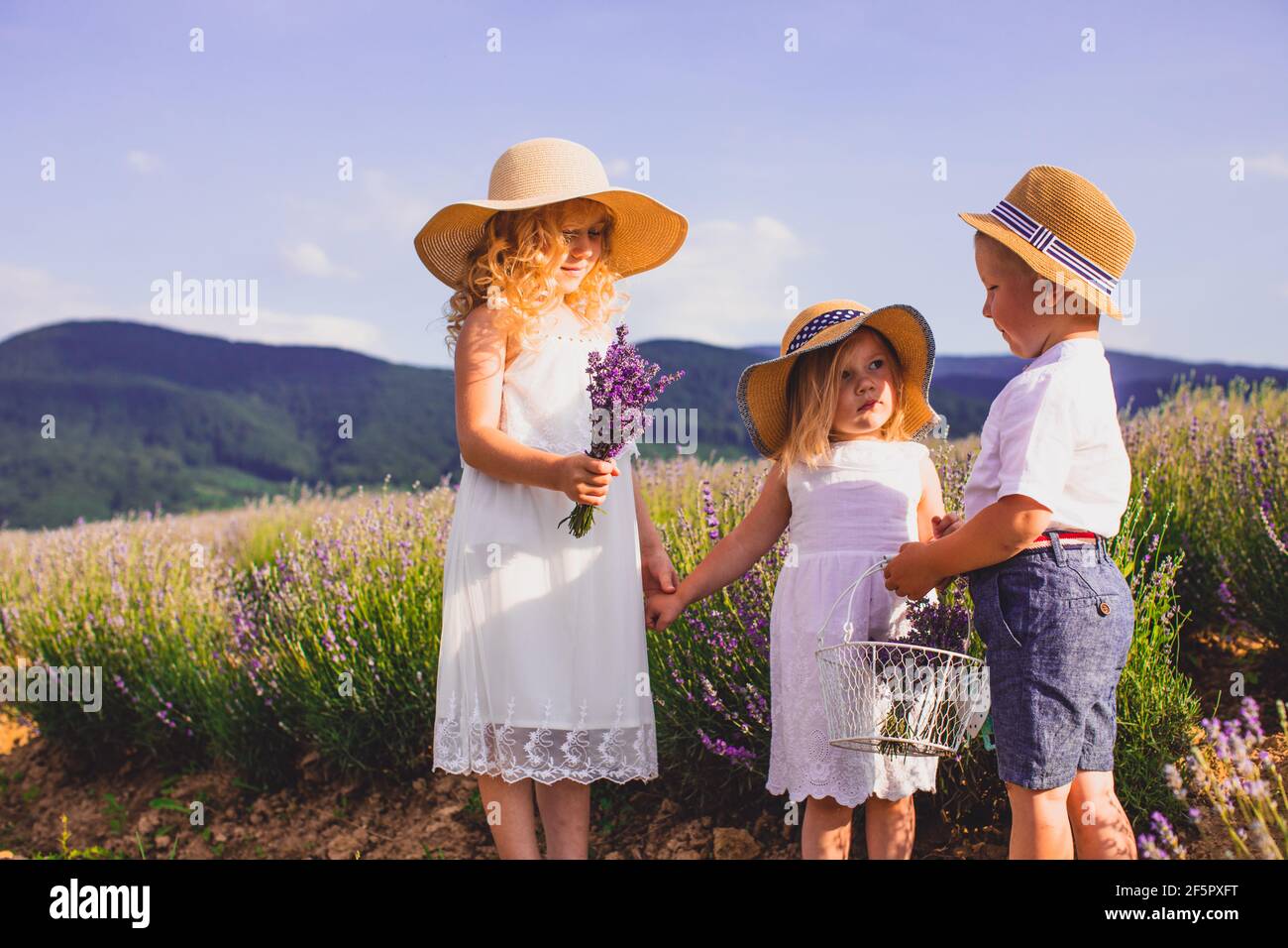 Three adorable kids, brother and two sisters Stock Photo - Alamy