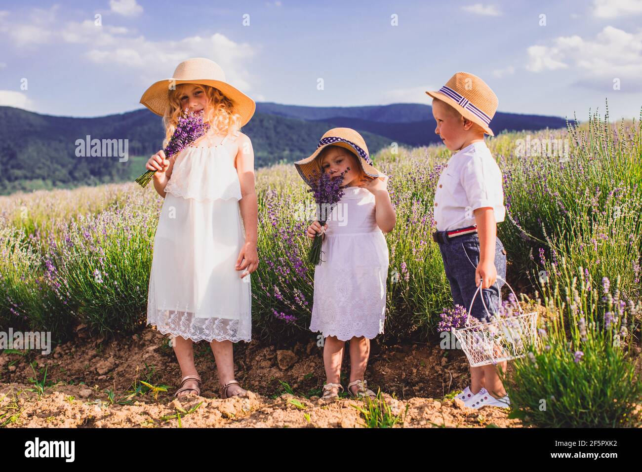 Three adorable kids, brother and two sisters Stock Photo - Alamy
