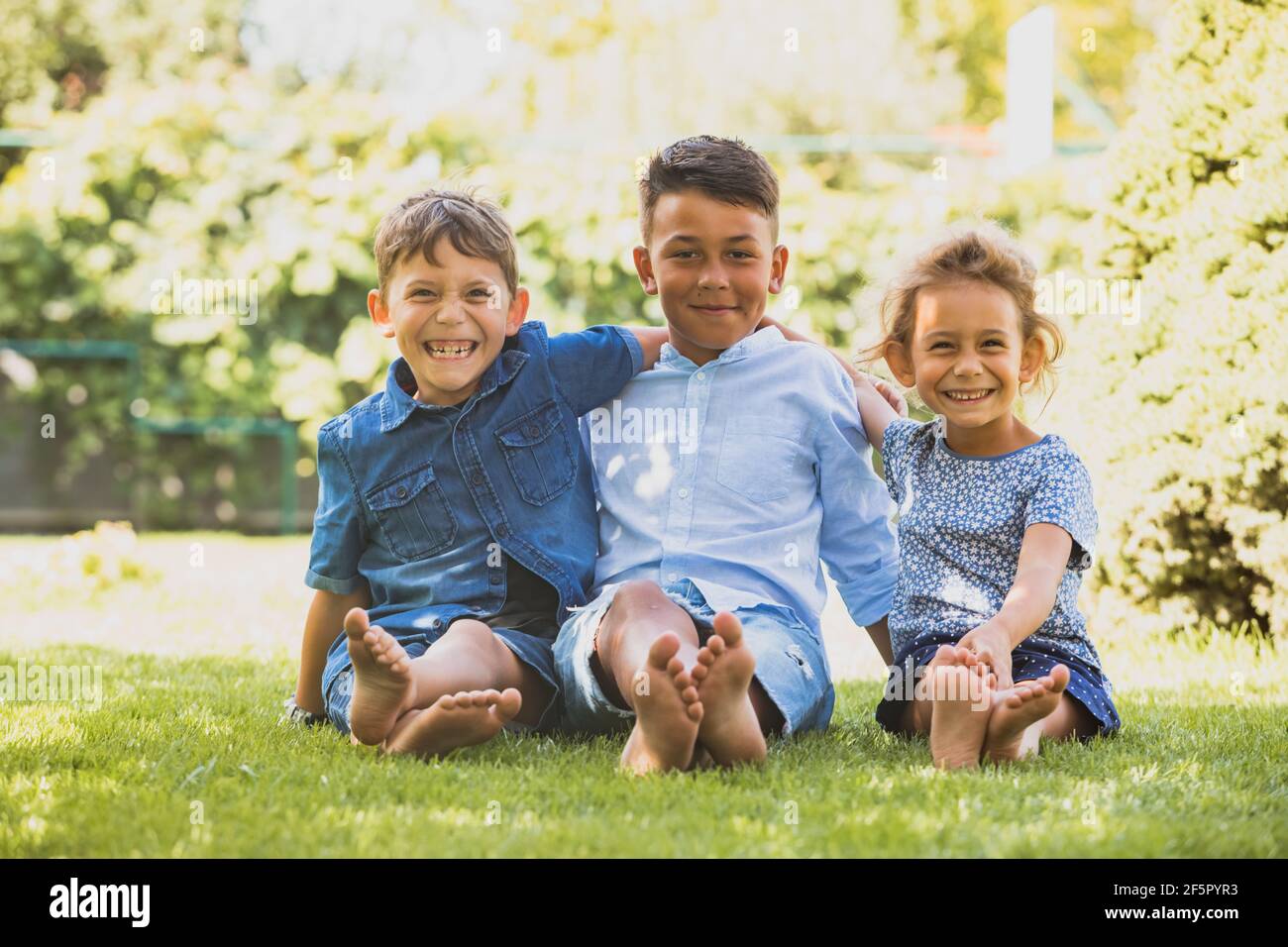 The best friends having fun on a green lawn Stock Photo - Alamy