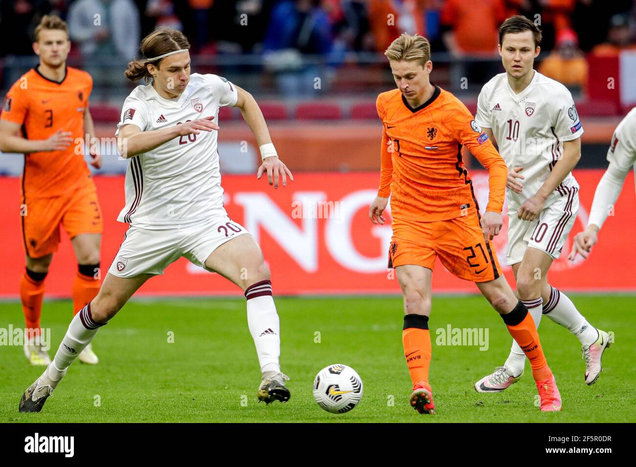 AMSTERDAM, NETHERLANDS - MARCH 27: Roberts Uldrikis of Latvia, Frenkie ...