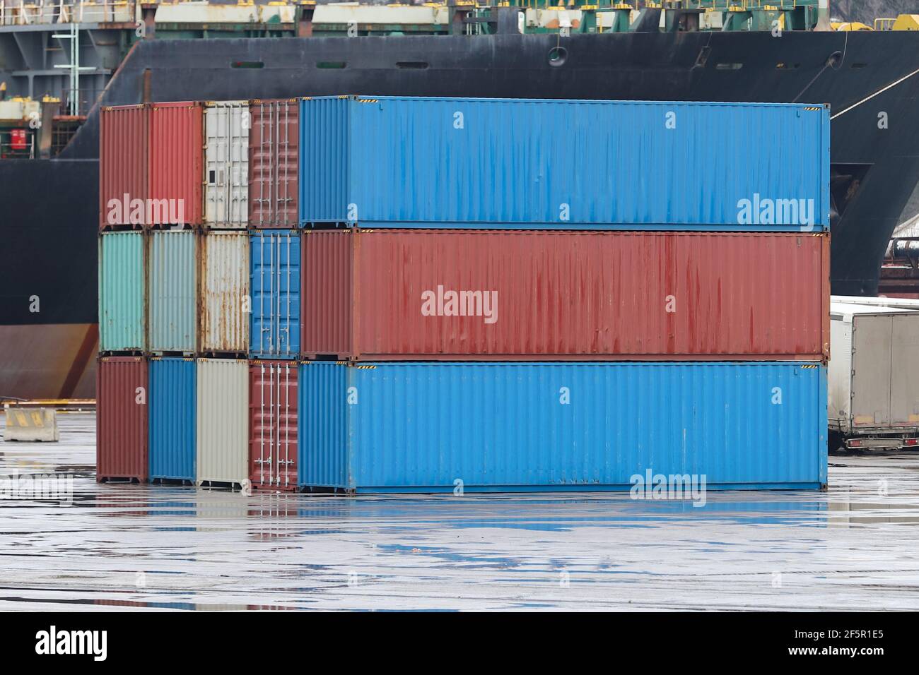Containers waiting to transfer in a port Stock Photo - Alamy