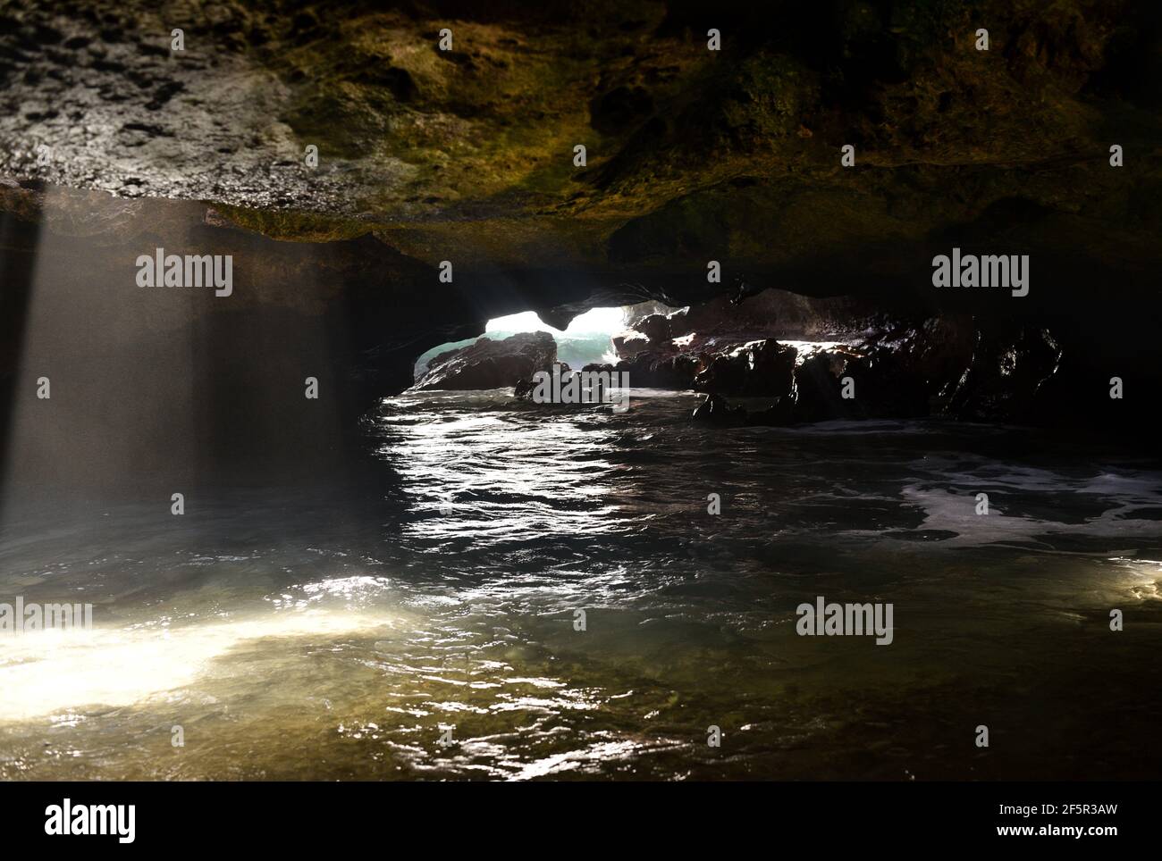 Spectacular Mermaid Caves with sunlight piercing through hole in ...