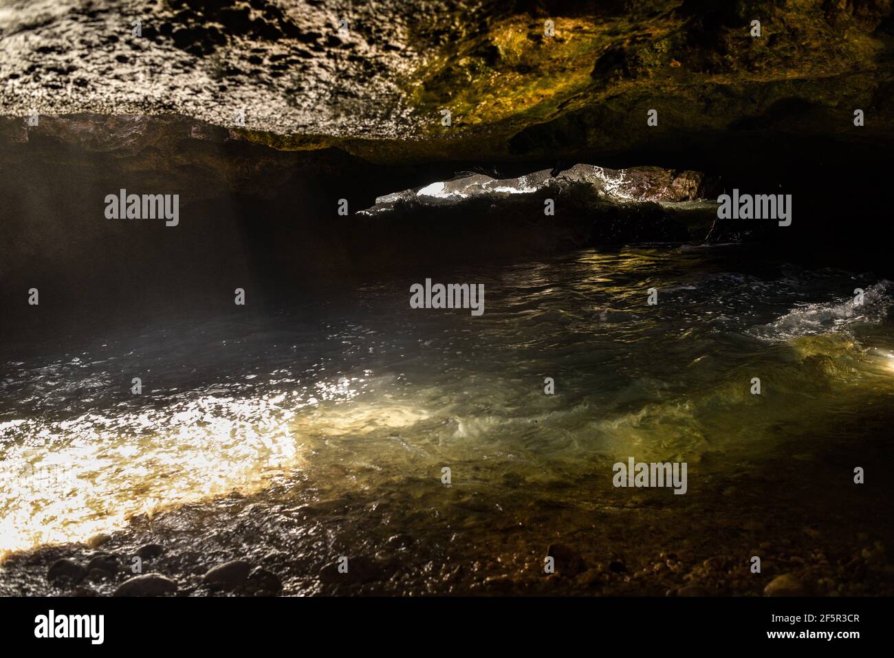 Spectacular Mermaid Caves with sunlight piercing through hole in ...