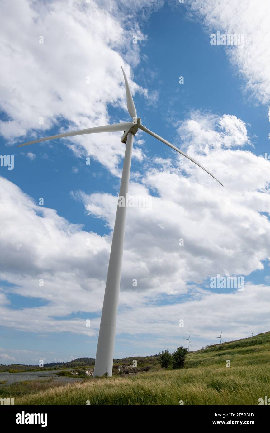 Windmills power generators on a turbine farm generating electricity ...