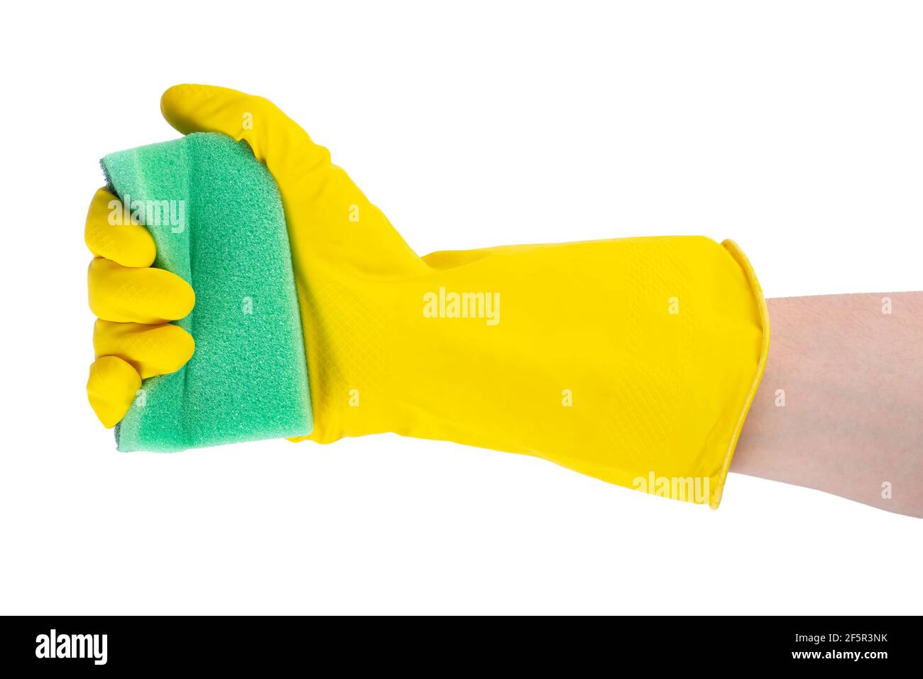 Cleaning concept - hand in a yellow rubber glove holds a green sponge ...
