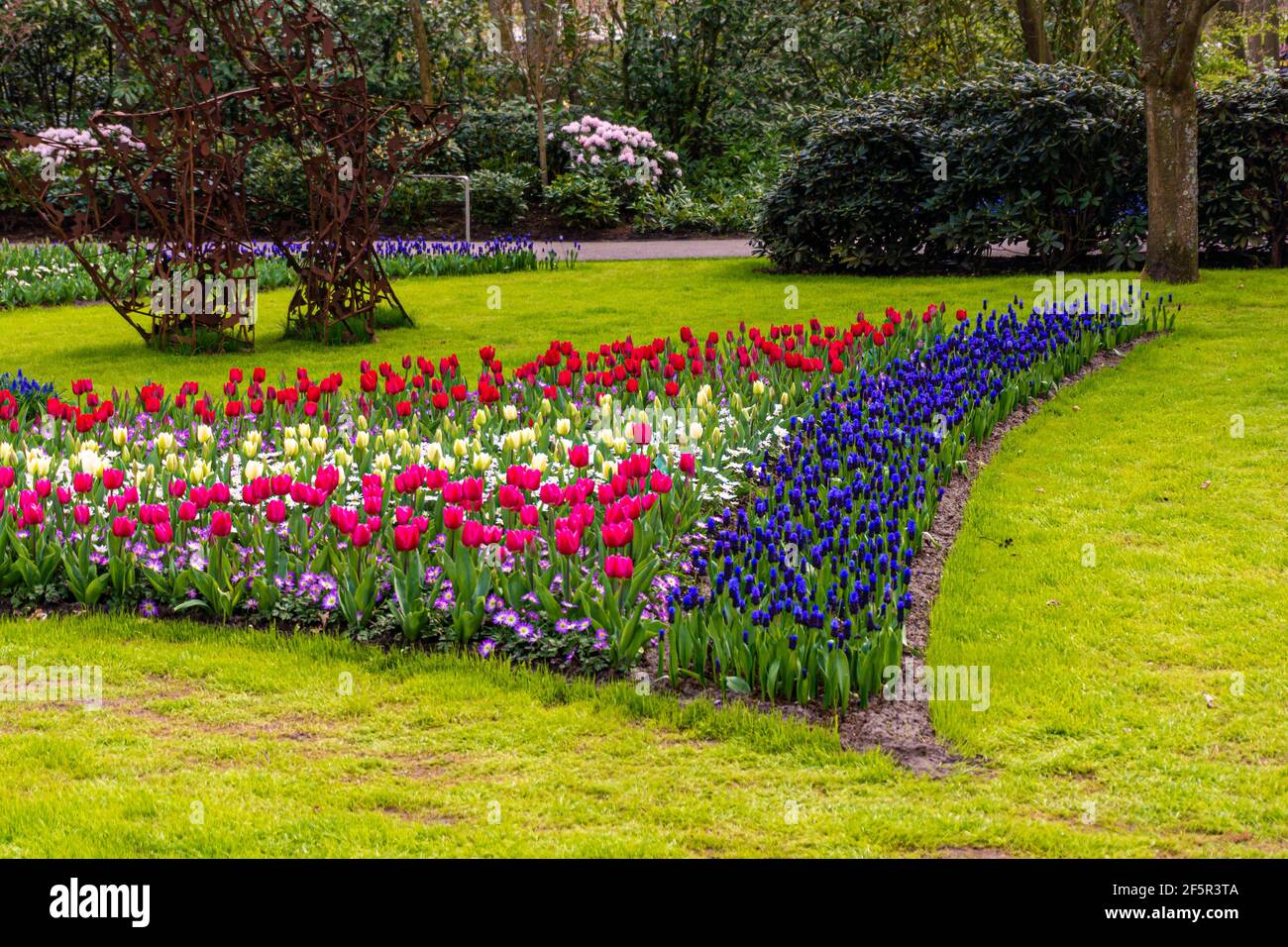 Colorful garden landscape and grassy lawn Stock Photo - Alamy