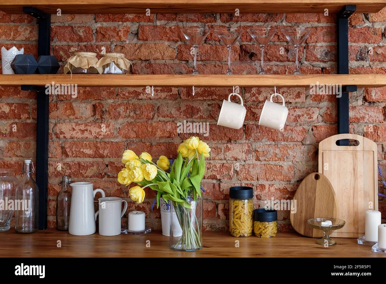 Contemporary kitchen background with kitchen utensils standing on ...