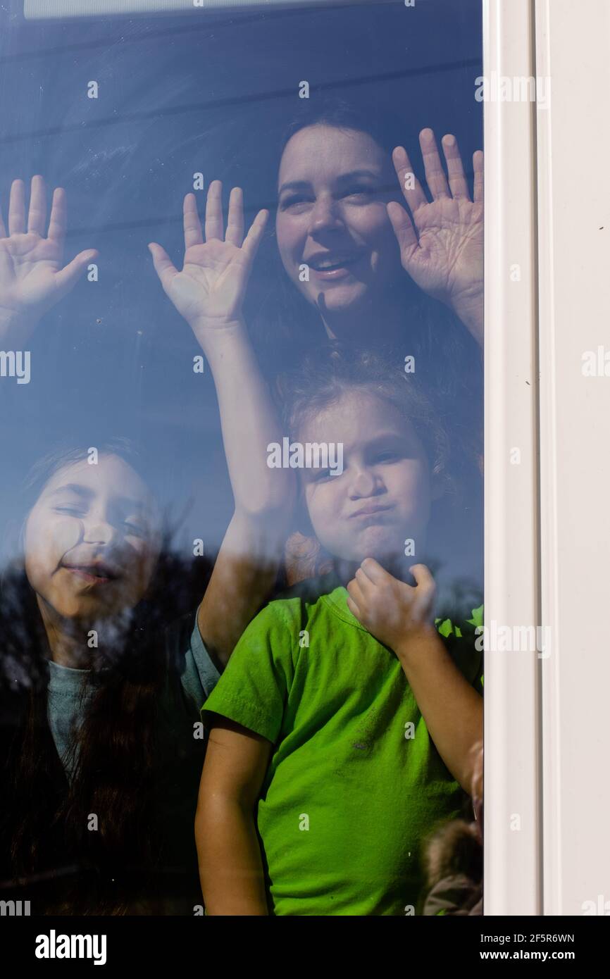 Mom and her daughters enjoy the spring weather indoor Stock Photo - Alamy