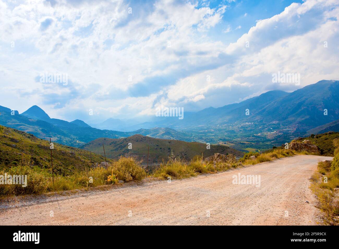Beautiful summer landscape with a desert road in the valley, island of ...