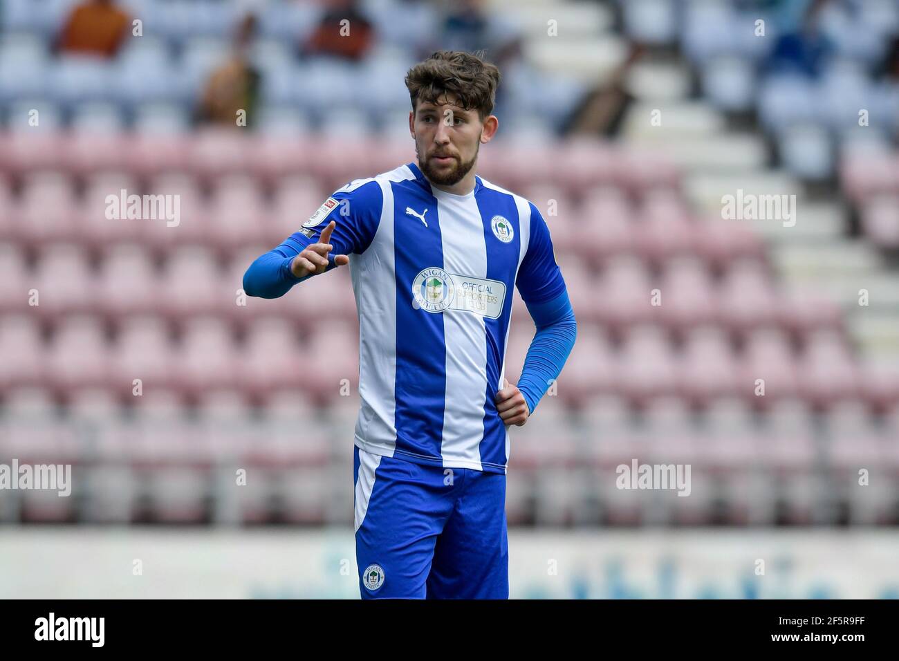 Wigan, UK. 27th Mar, 2021. Callum Lang #9 of Wigan Athletic in action ...