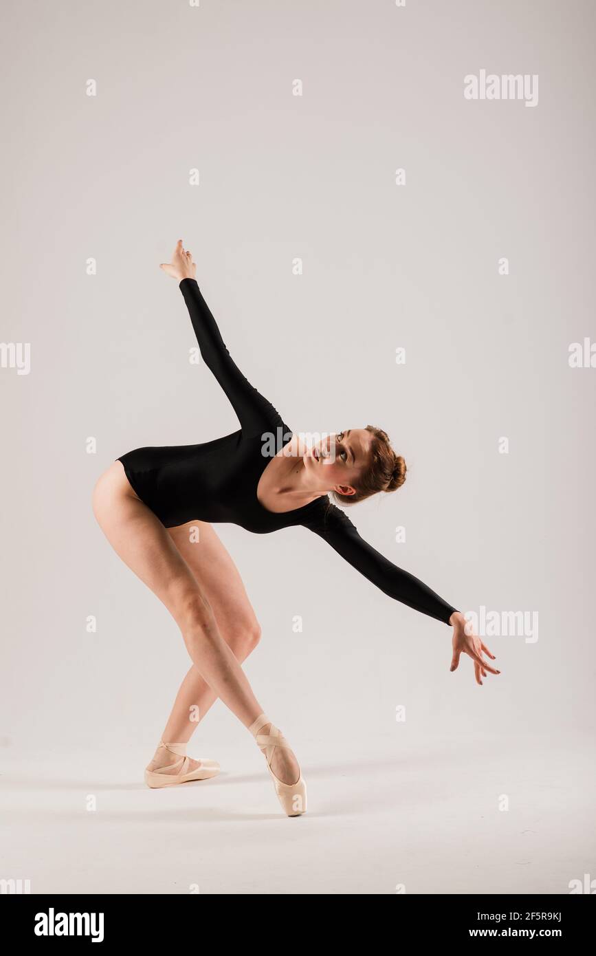 Modern style ballet dancer posing on a studio background Stock Photo ...