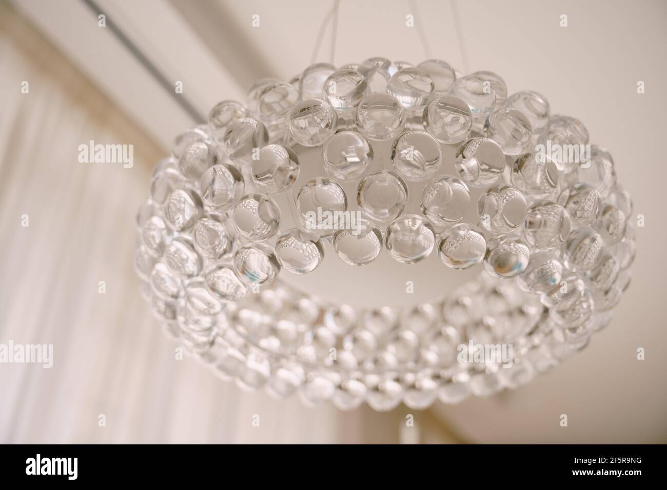 Stylish hi-tech chandelier made of transparent acrylic balls Stock ...