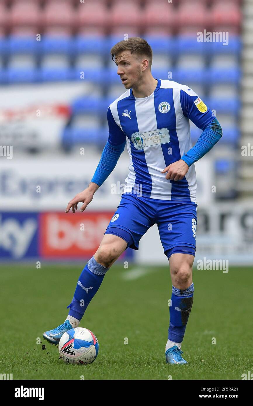 Wigan, UK. 27th Mar, 2021. Lee Evans #8 of Wigan Athletic in action ...