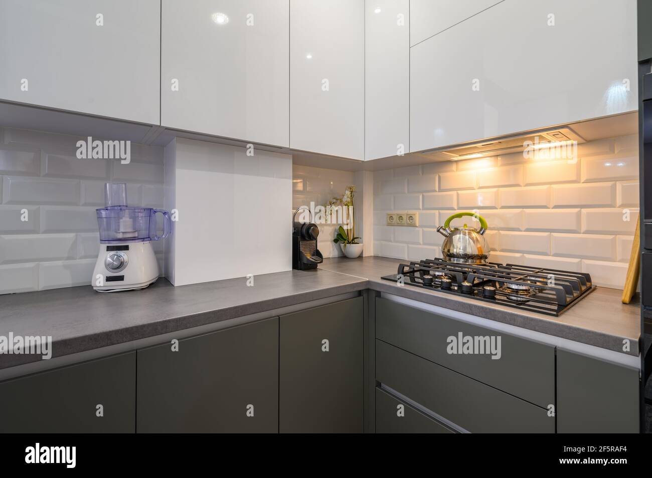 Modern dark grey small kitchen interior Stock Photo - Alamy