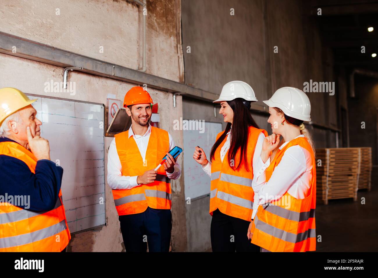 The engineers enjoy the work at the enterprise Stock Photo - Alamy