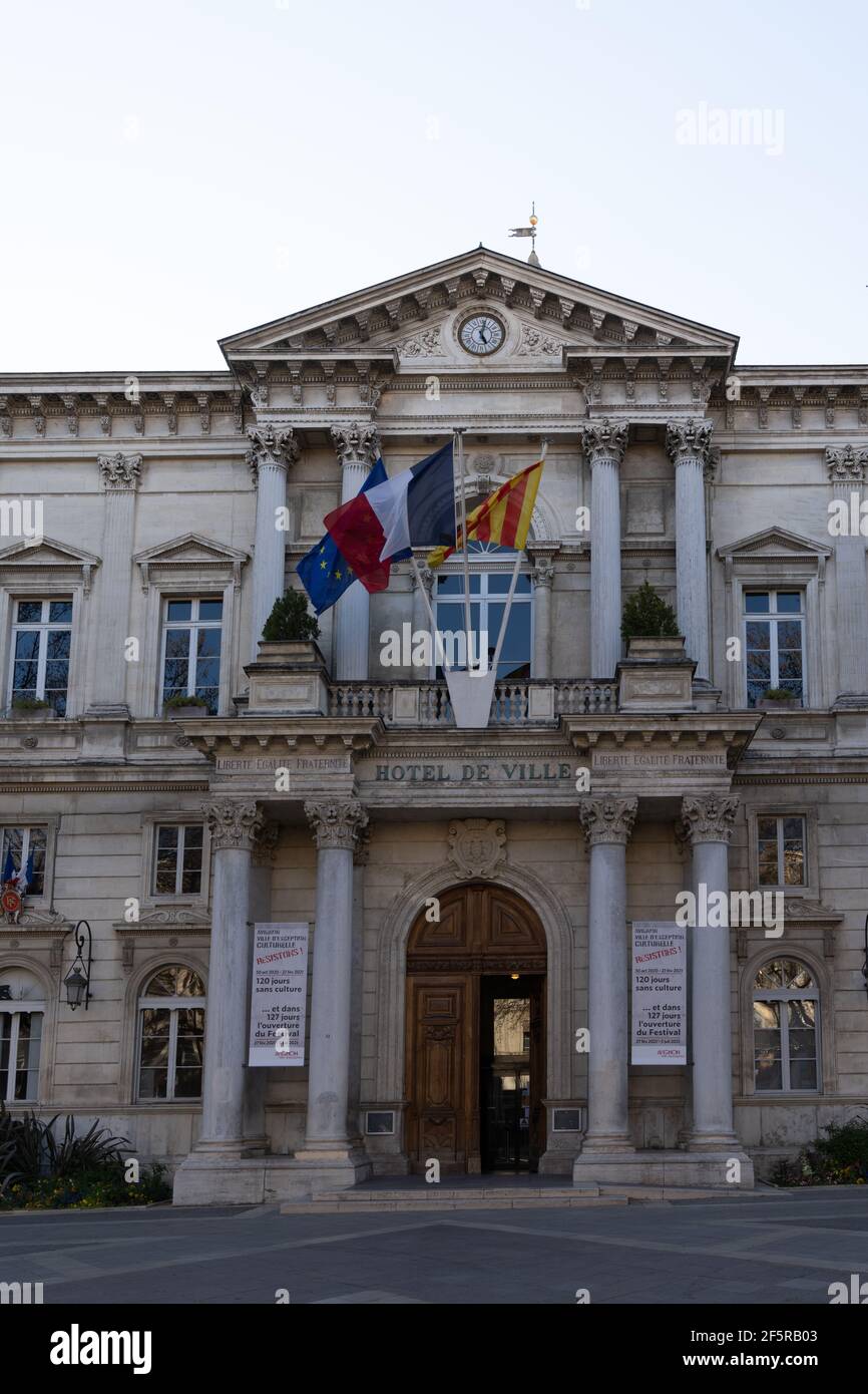 Avignon, France - 18 March, 2021: city hall building with flags of ...