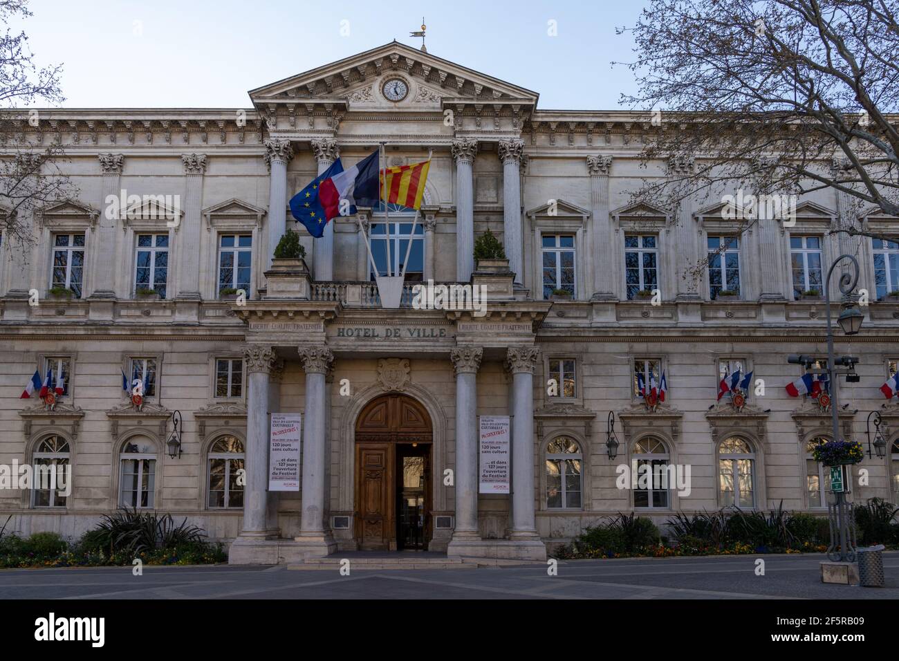 Avignon, France - 18 March, 2021: city hall building with flags of ...