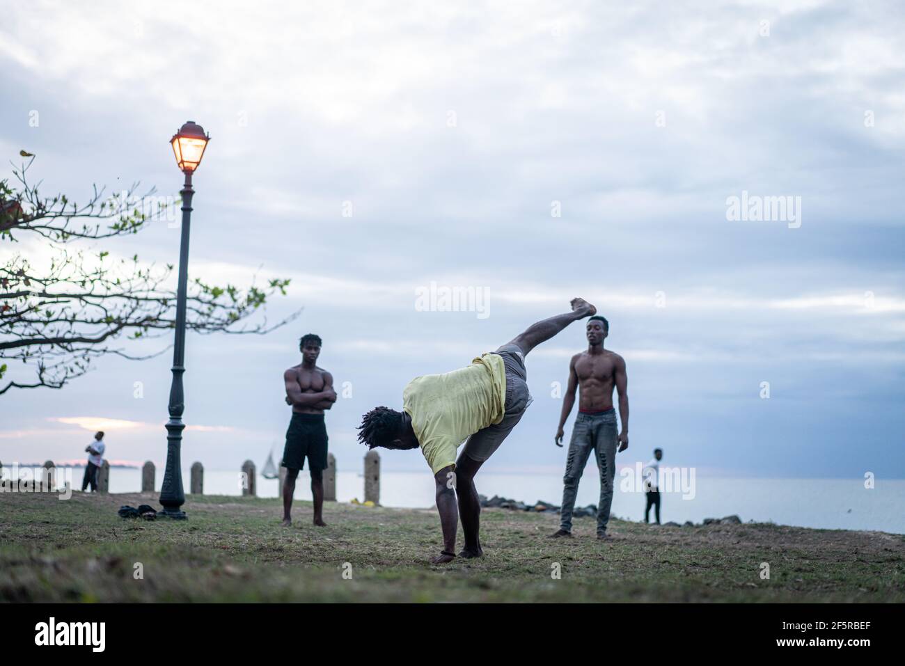 Young men exercising martial arts on the beach Stock Photo - Alamy