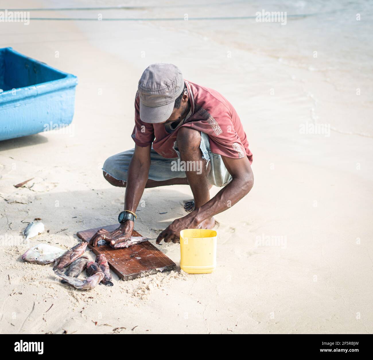 Man cooking fish on boat hi-res stock photography and images - Alamy