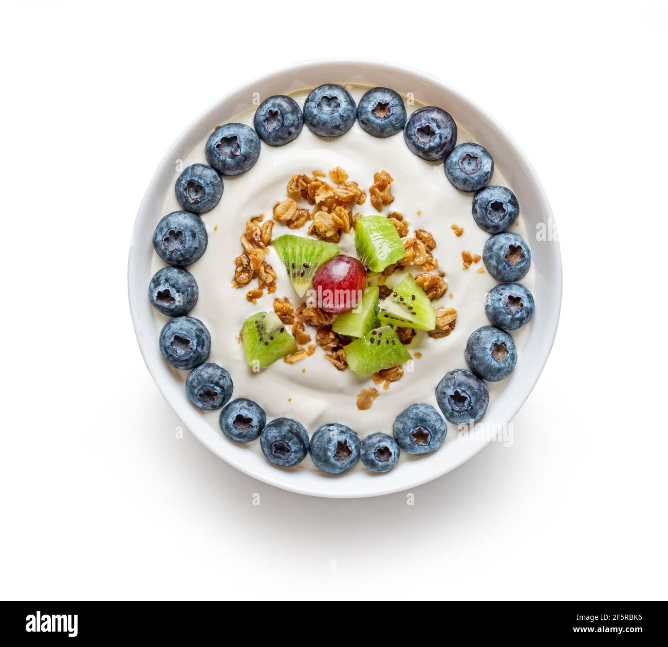 bowl of natural yogurt decorated with fruit and muesli isolated on ...