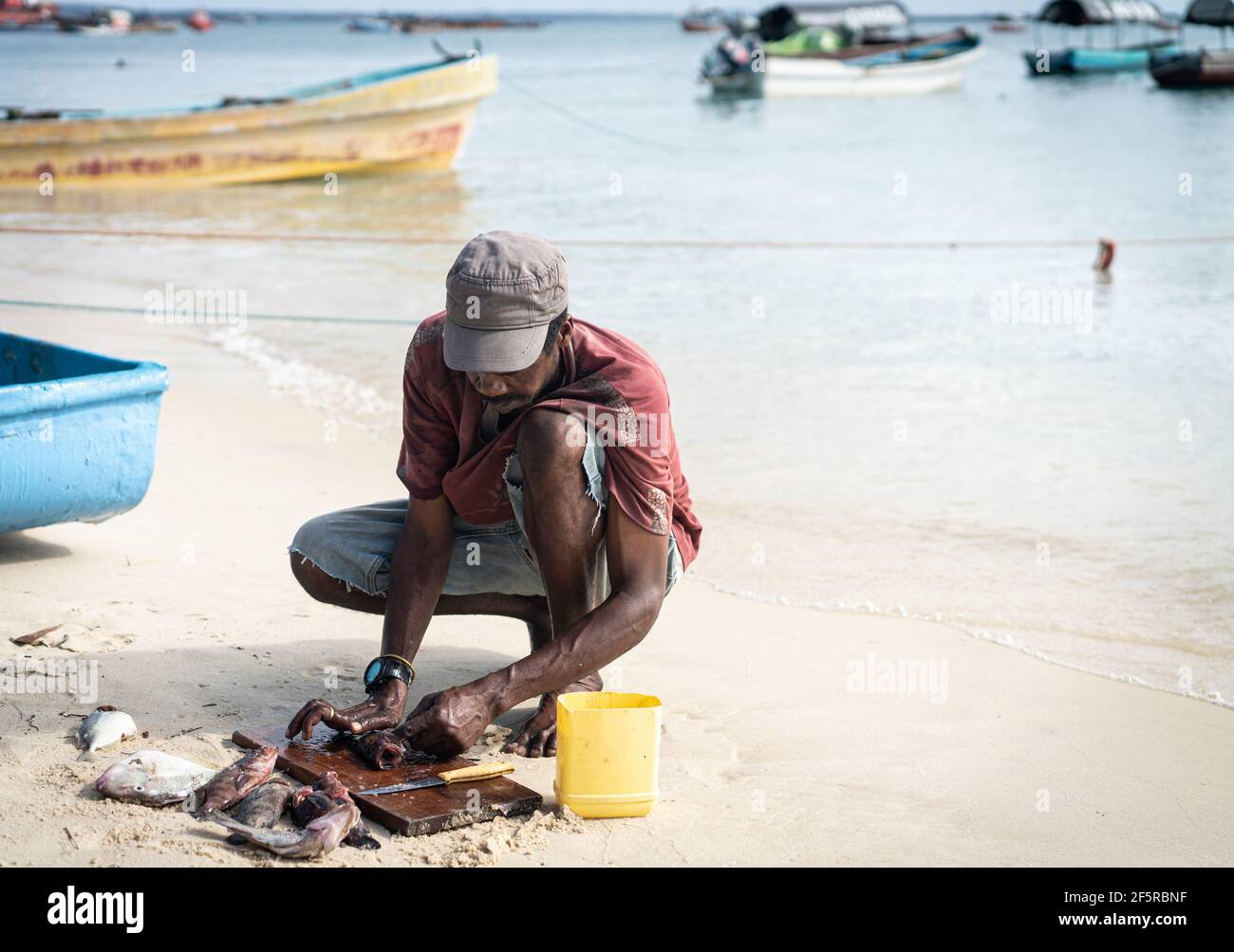 Candid black fisherman on the coast ocean Stock Photo - Alamy