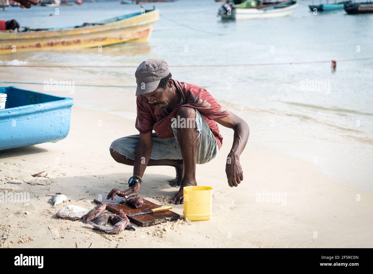 Candid black fisherman on the coast ocean Stock Photo - Alamy