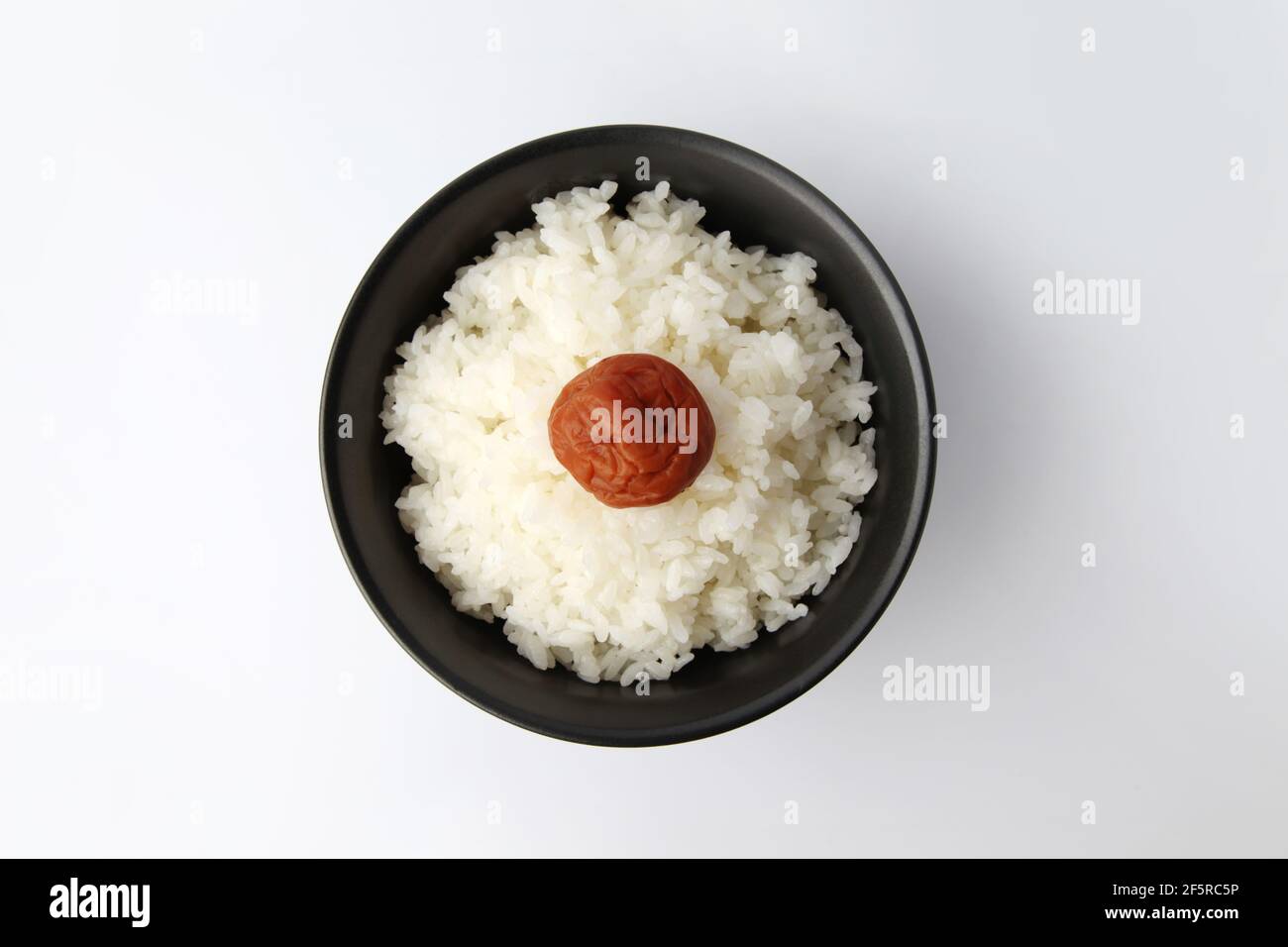 plain white rice with salt pickled plum in bowl chopsticks isolated on ...