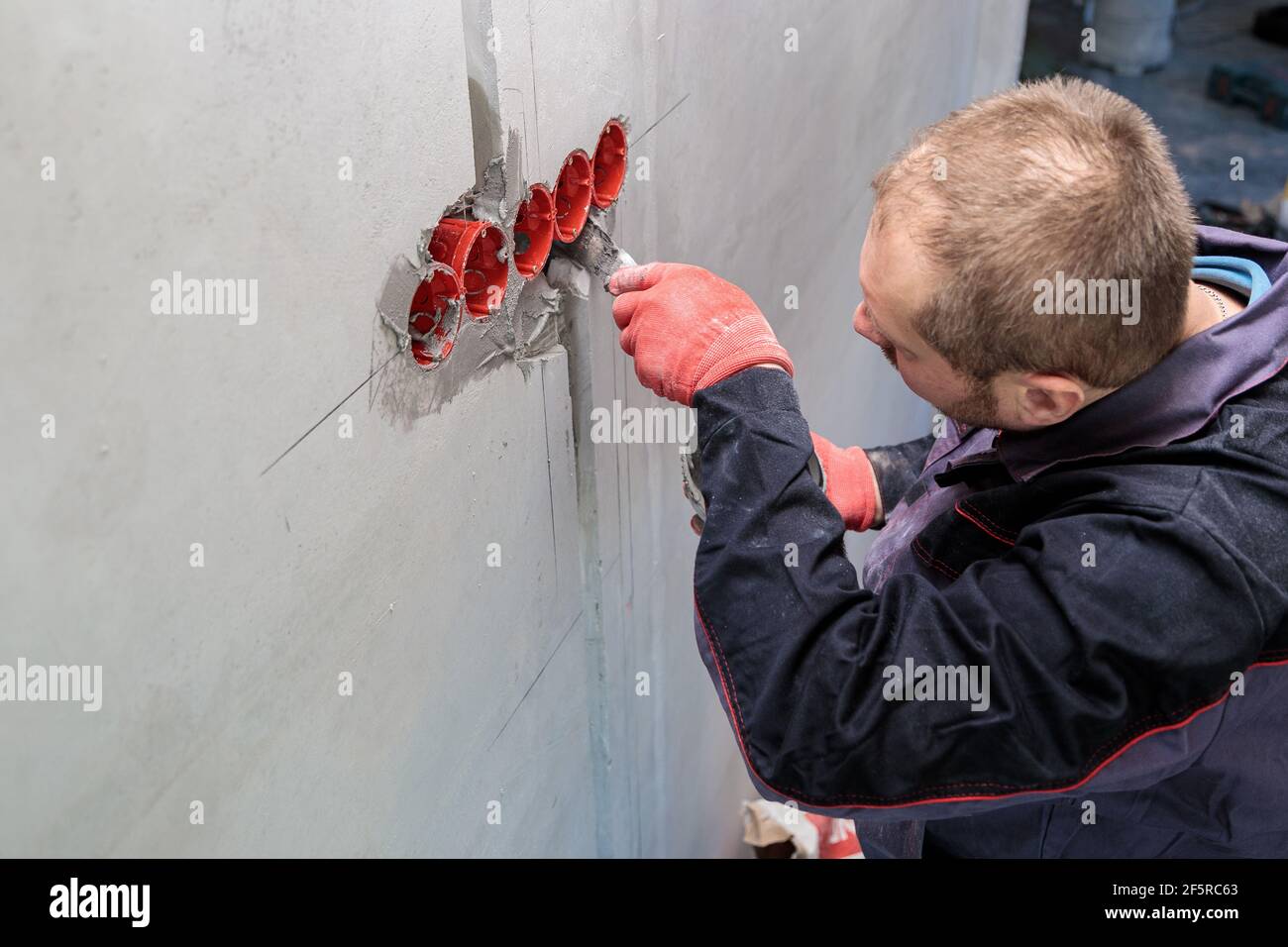 The electrician will plaster holes and channels for sockets and wires ...