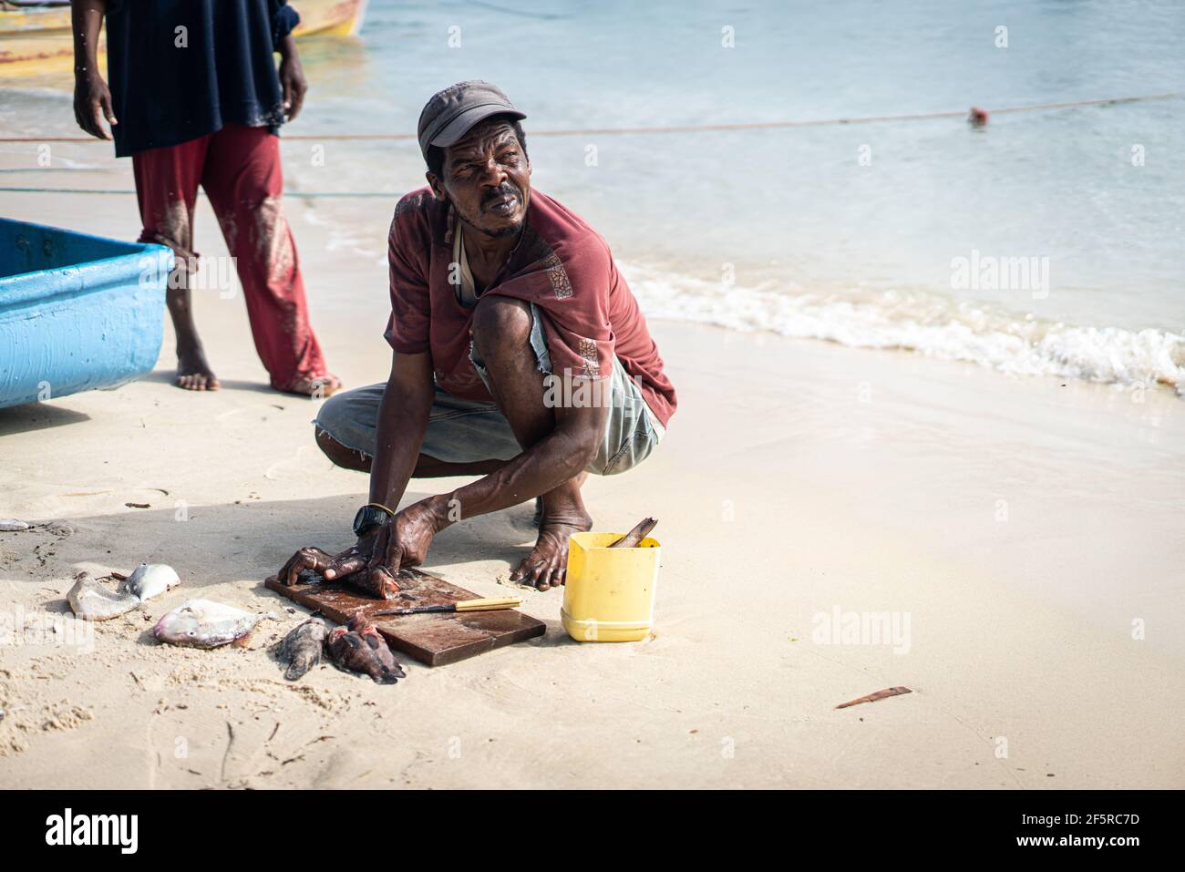 Man cooking fish on boat hi-res stock photography and images - Alamy