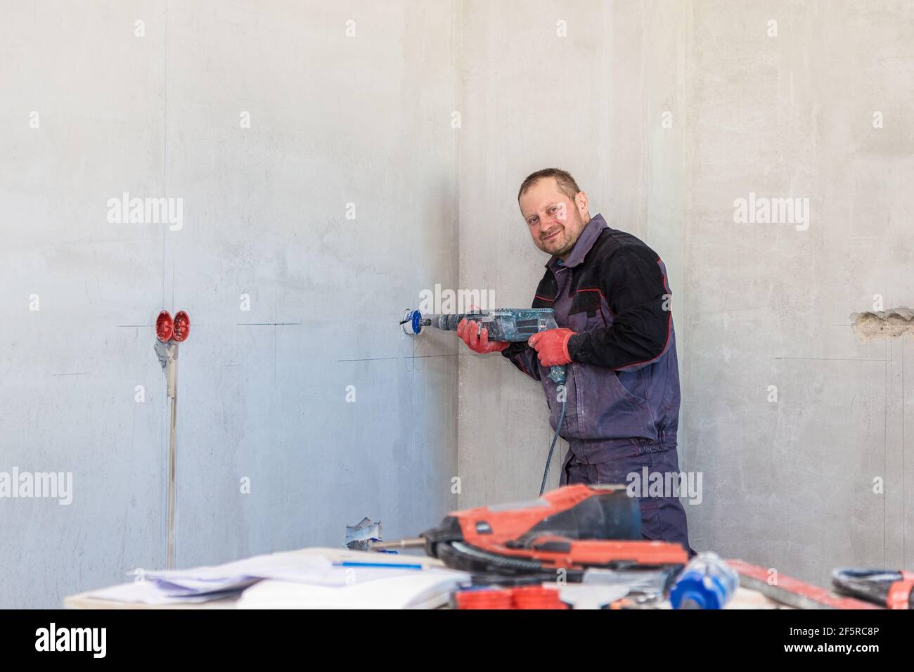 Worker drills holes bit hi-res stock photography and images - Alamy