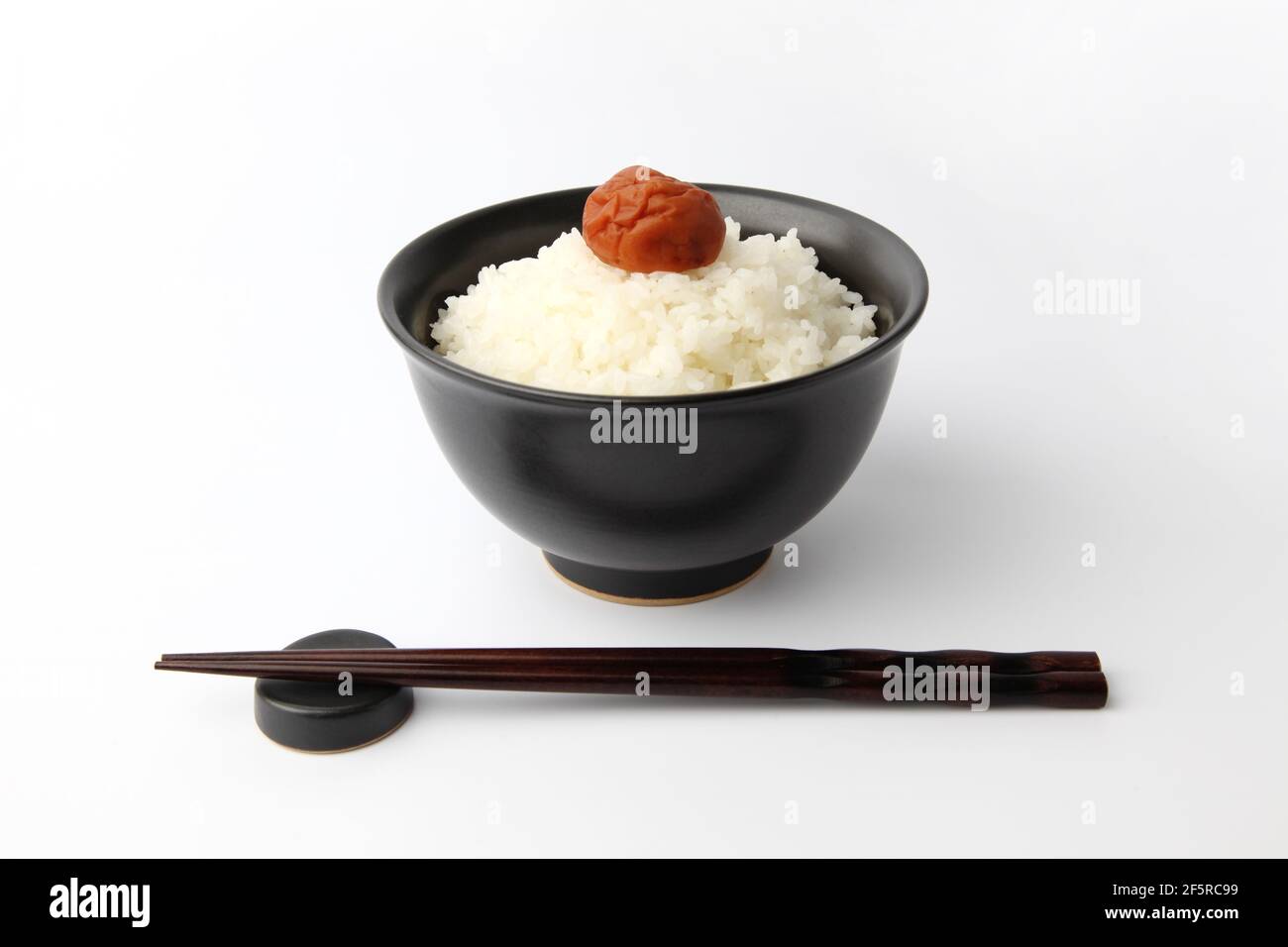 plain white rice with salt pickled plum in bowl chopsticks isolated on ...