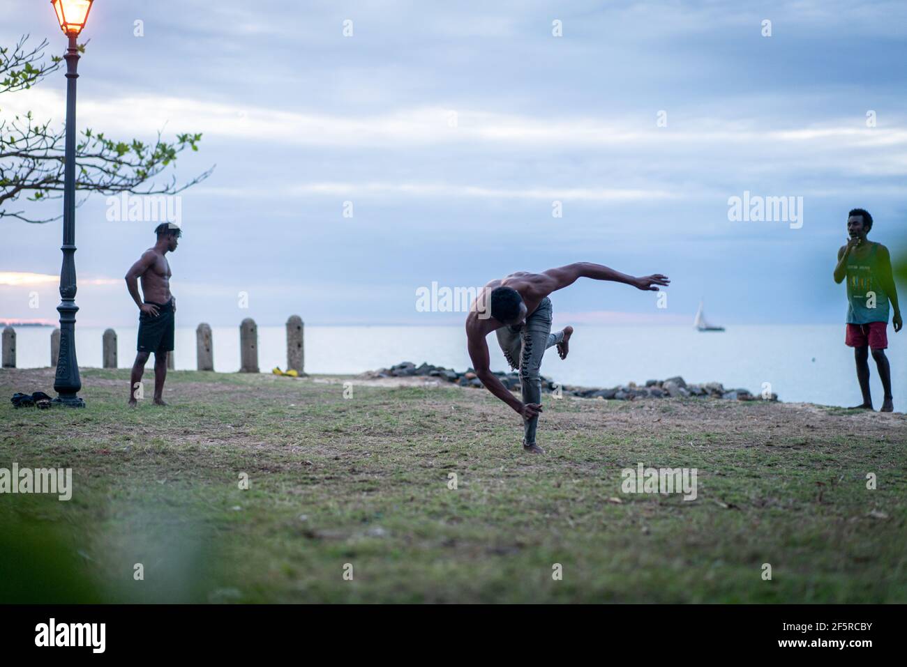 Young men exercising martial arts on the beach Stock Photo - Alamy