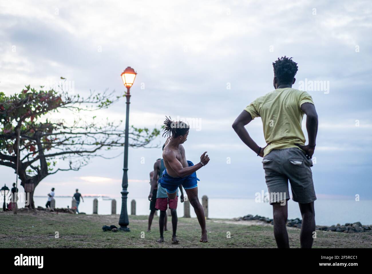 Young men exercising martial arts on the beach Stock Photo - Alamy