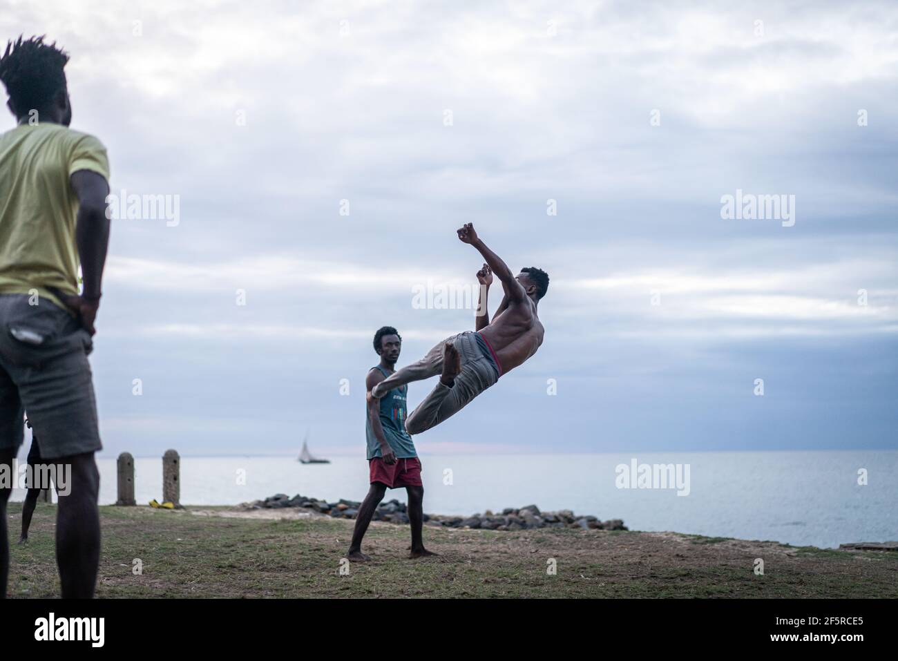 Young men exercising martial arts on the beach Stock Photo - Alamy