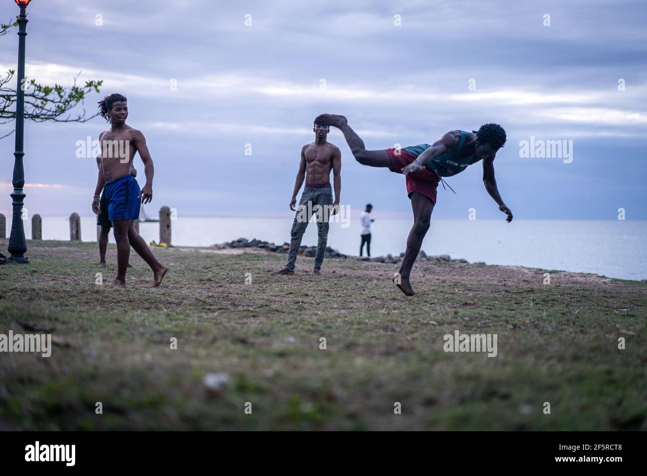 Young men exercising martial arts on the beach Stock Photo - Alamy