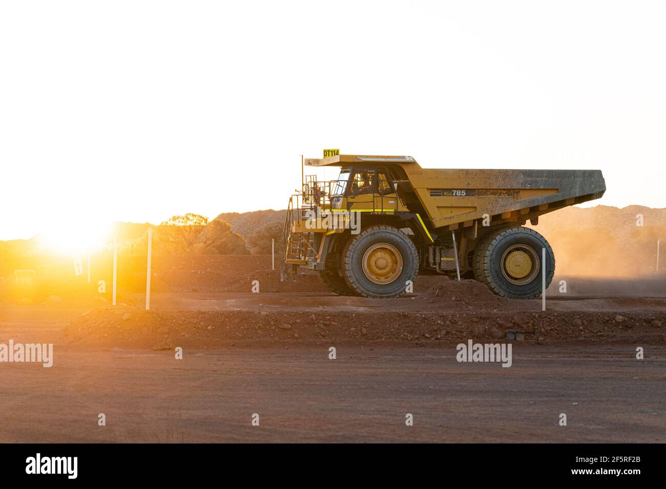 Dump truck driving on haul road at sunset at open pit mining area Stock ... Dump truck driving on haul road at sunset at open pit mining area Stock ...