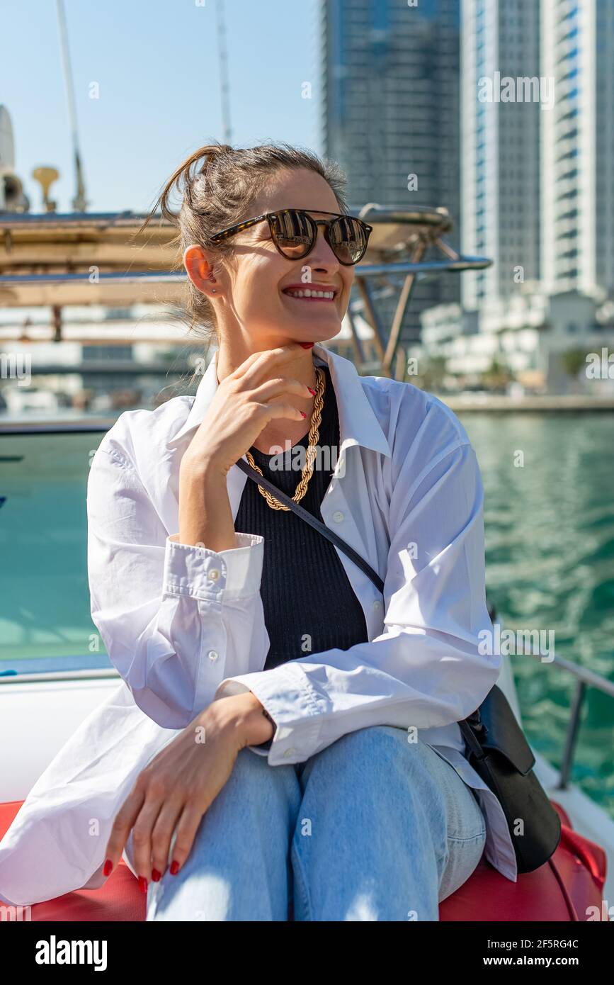 pretty woman enjoys life on boat Stock Photo - Alamy