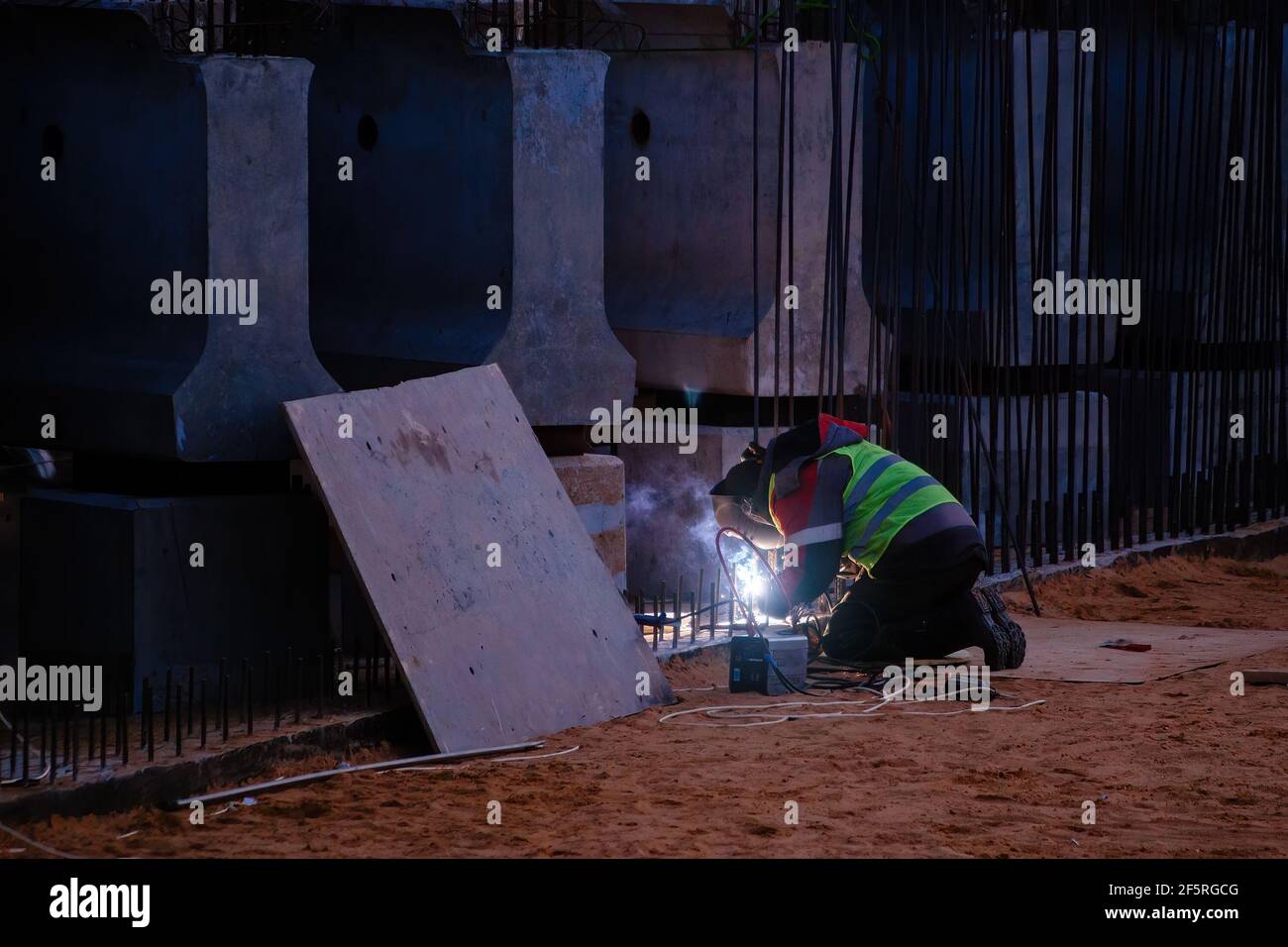 Welder working on the road bridge construction Stock Photo - Alamy
