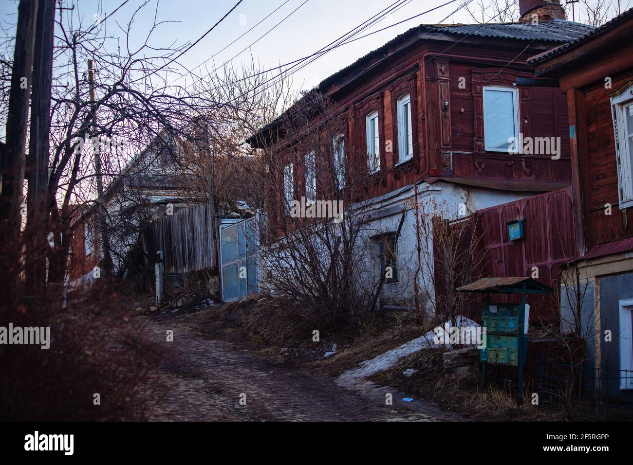 Old houses on low-rise street in old poverty part of Voronezh in Russia ...
