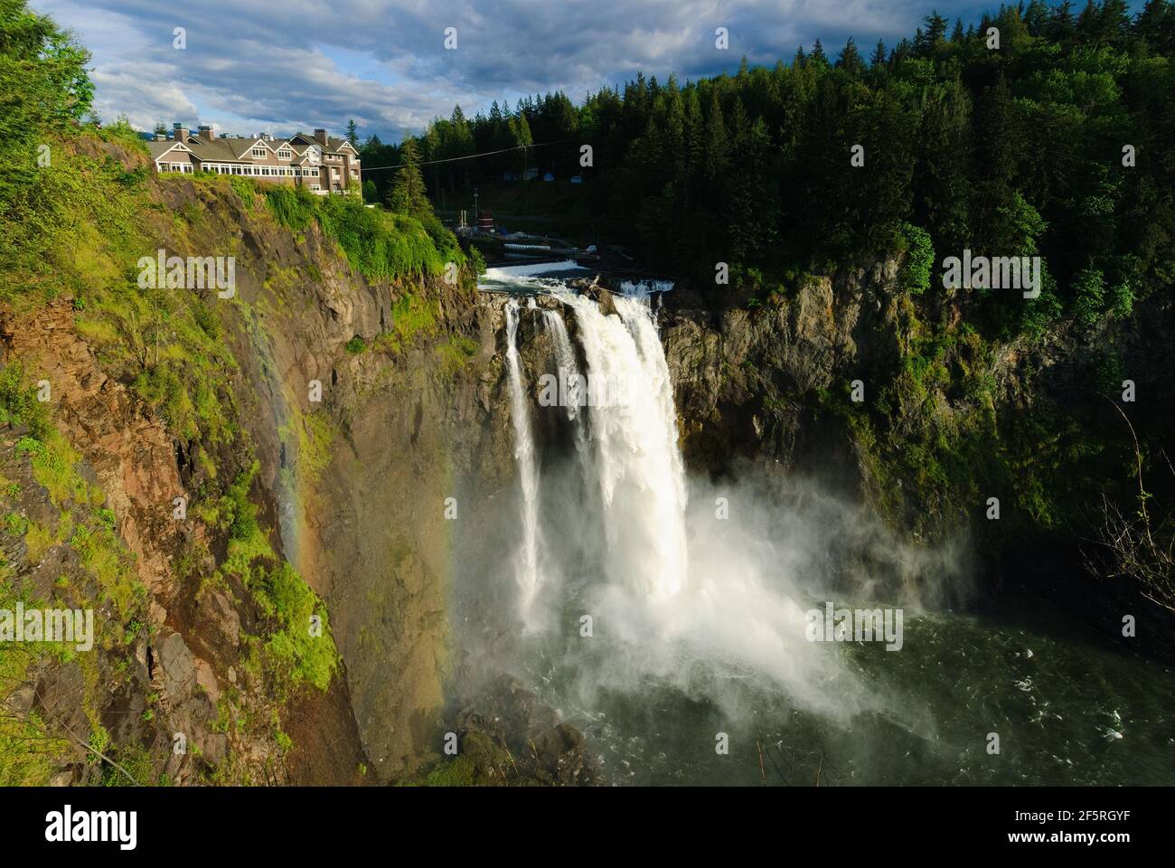 Snoqualmie Falls plunges alongside the Salish Lodge on a Spring evening ...