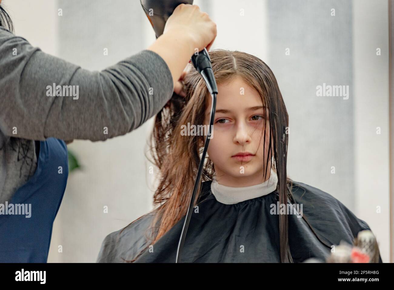 Happy Girl Getting her Hair Cut. A series of photos of a girl getting ...