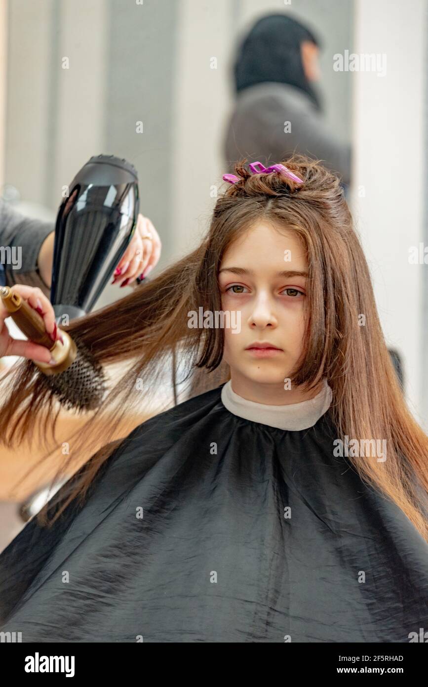 Happy Girl Getting her Hair Cut. A series of photos of a girl getting ...