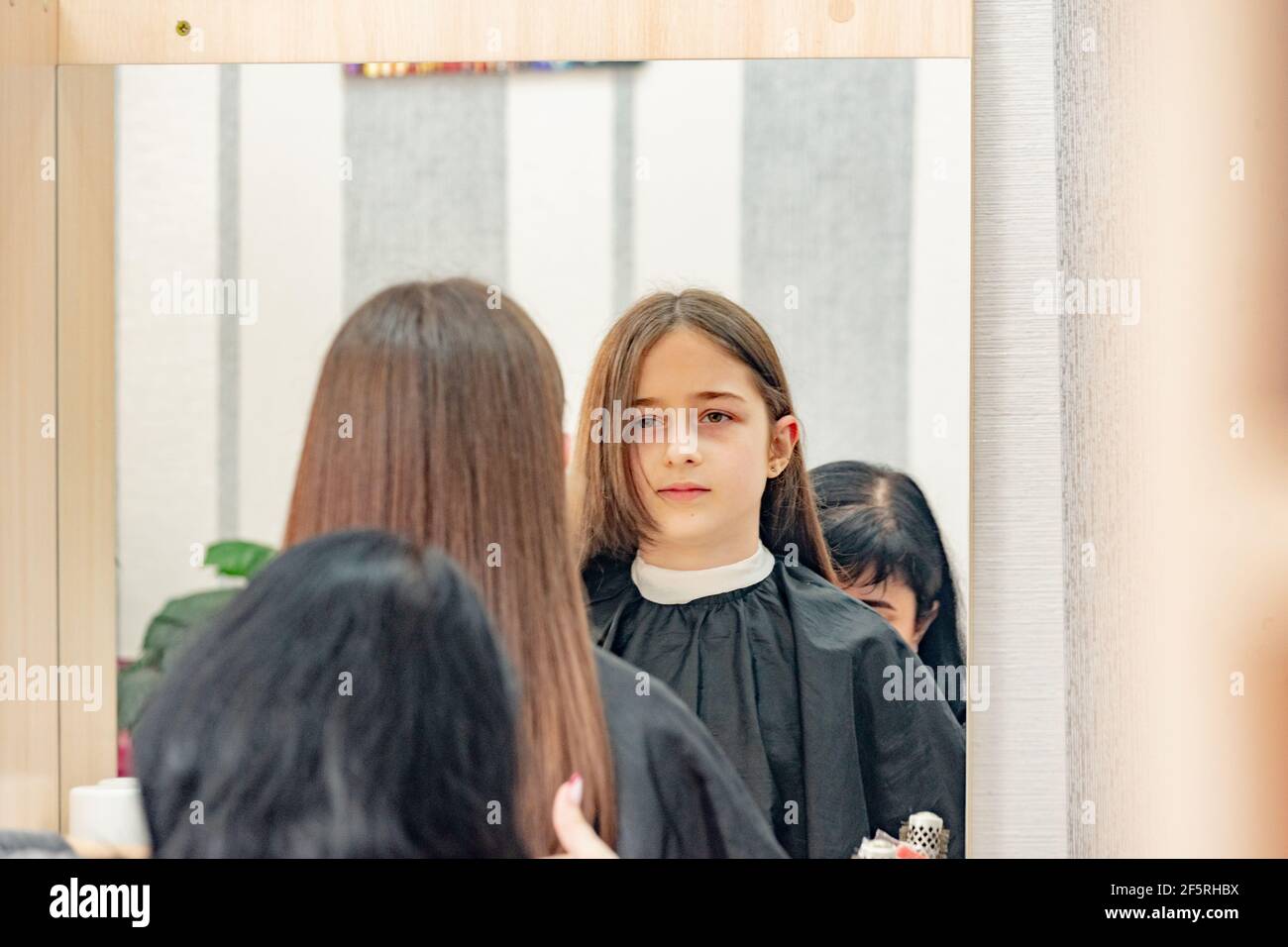 Happy Girl Getting her Hair Cut. A series of photos of a girl getting ...