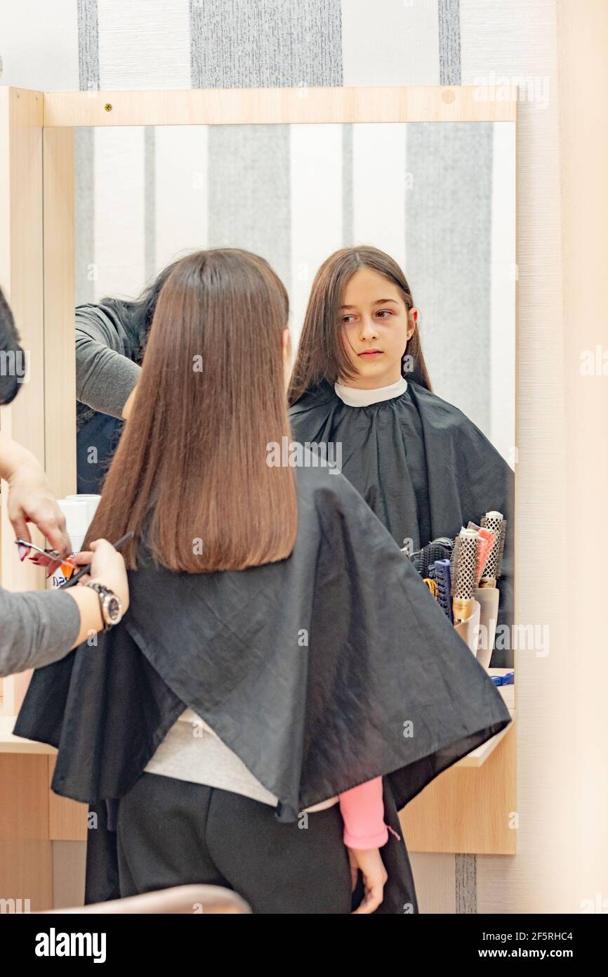 Happy Girl Getting her Hair Cut. A series of photos of a girl getting ...