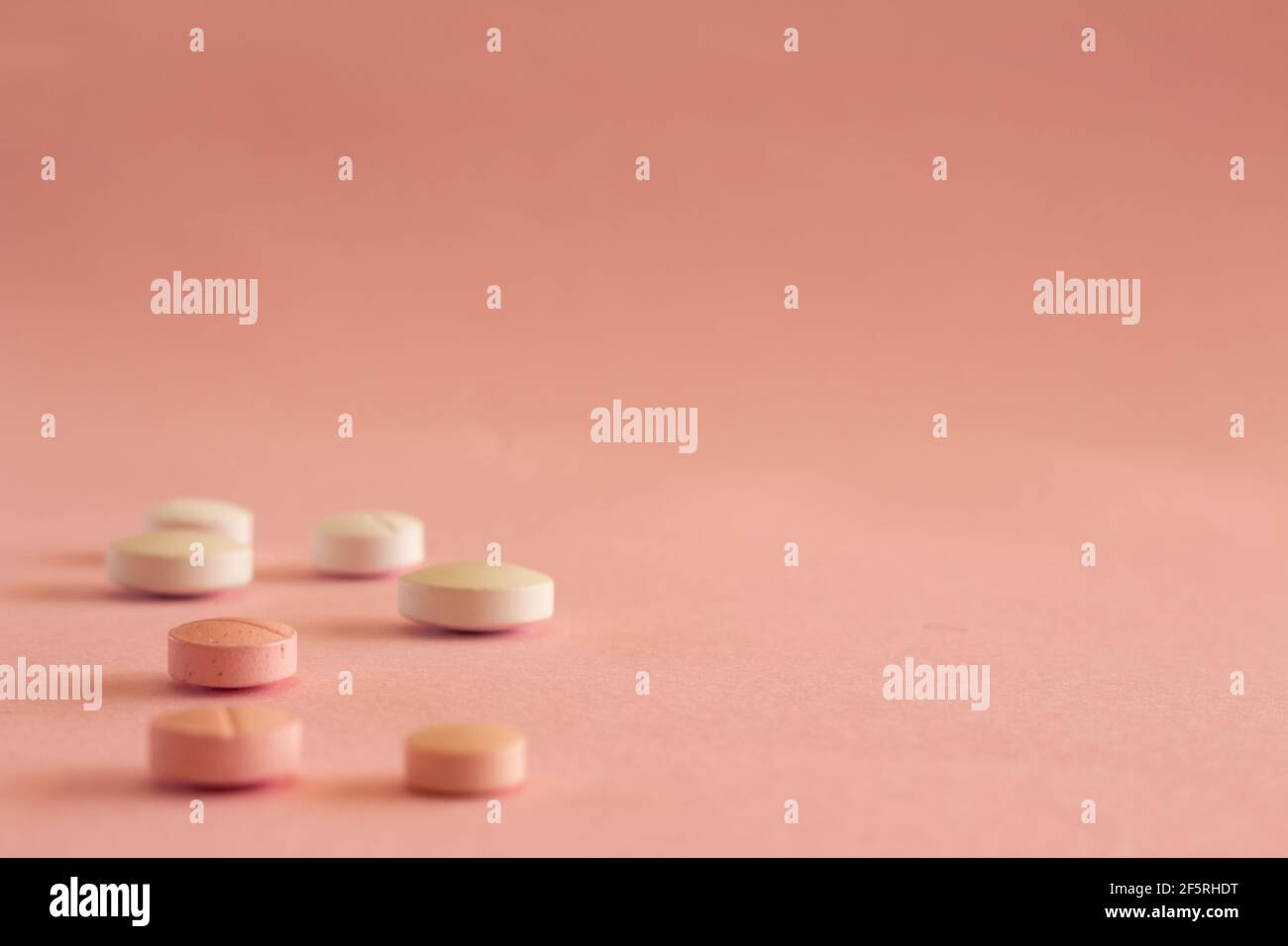 Pills of colors on neutral background. Legal drugs from the ...