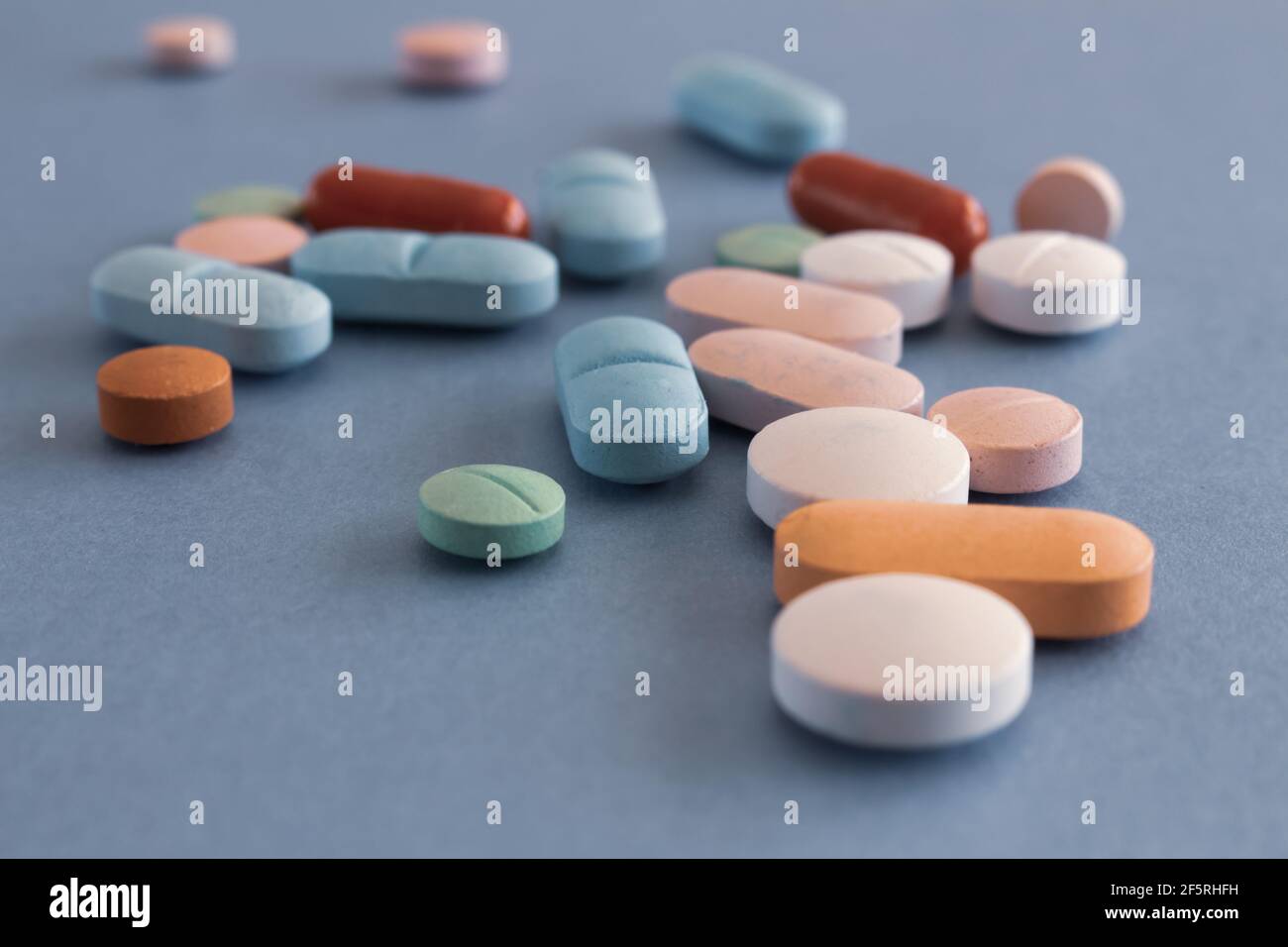 Pills of colors on neutral background. Legal drugs from the ...