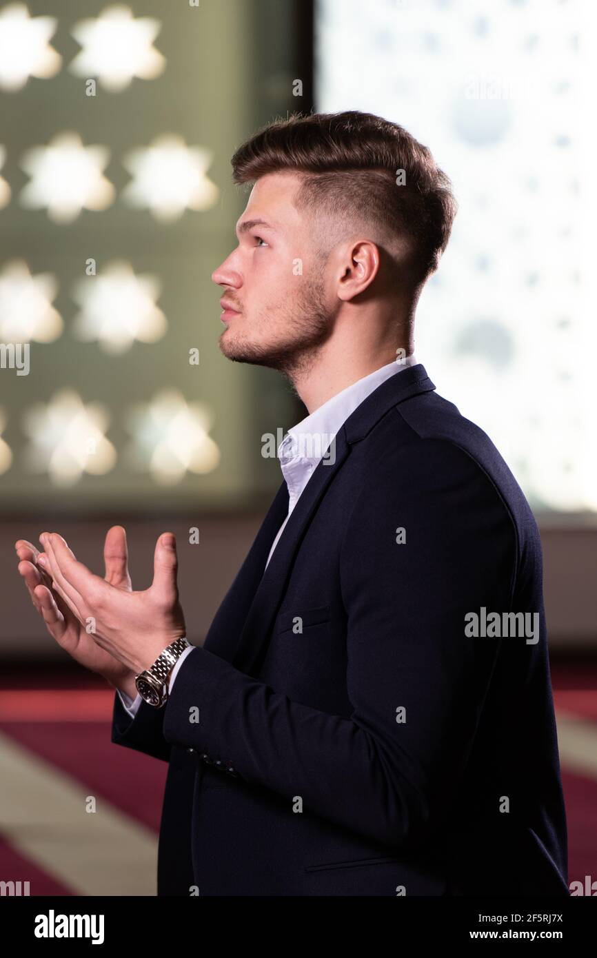 Attractive Man Making Traditional Prayer to God Allah in the Mosque ...